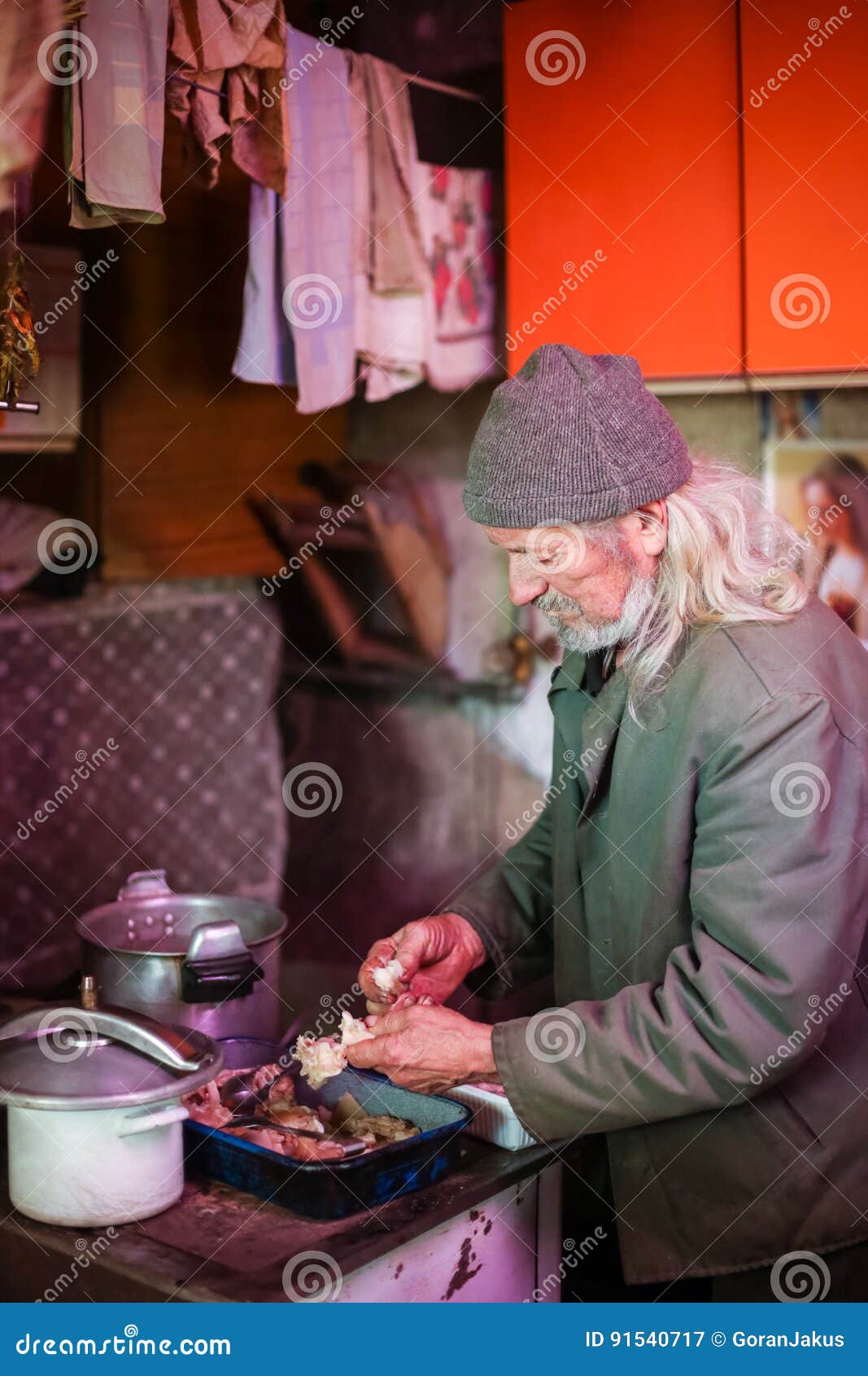 Old man cooking meat stock image. Image of inside, indoors - 91540717