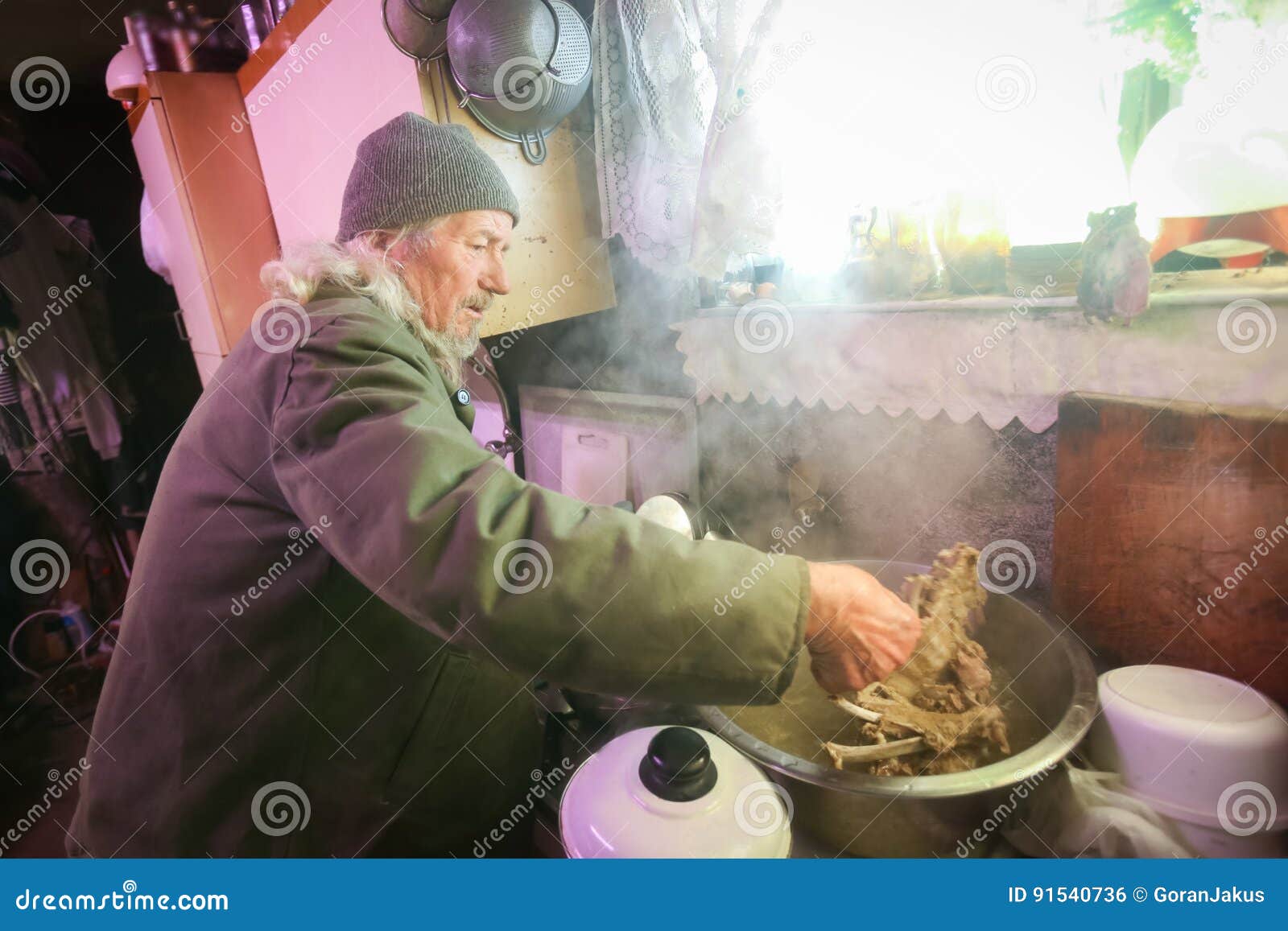 Old man cooking pork stock photo. Image of beard, gray - 91540736