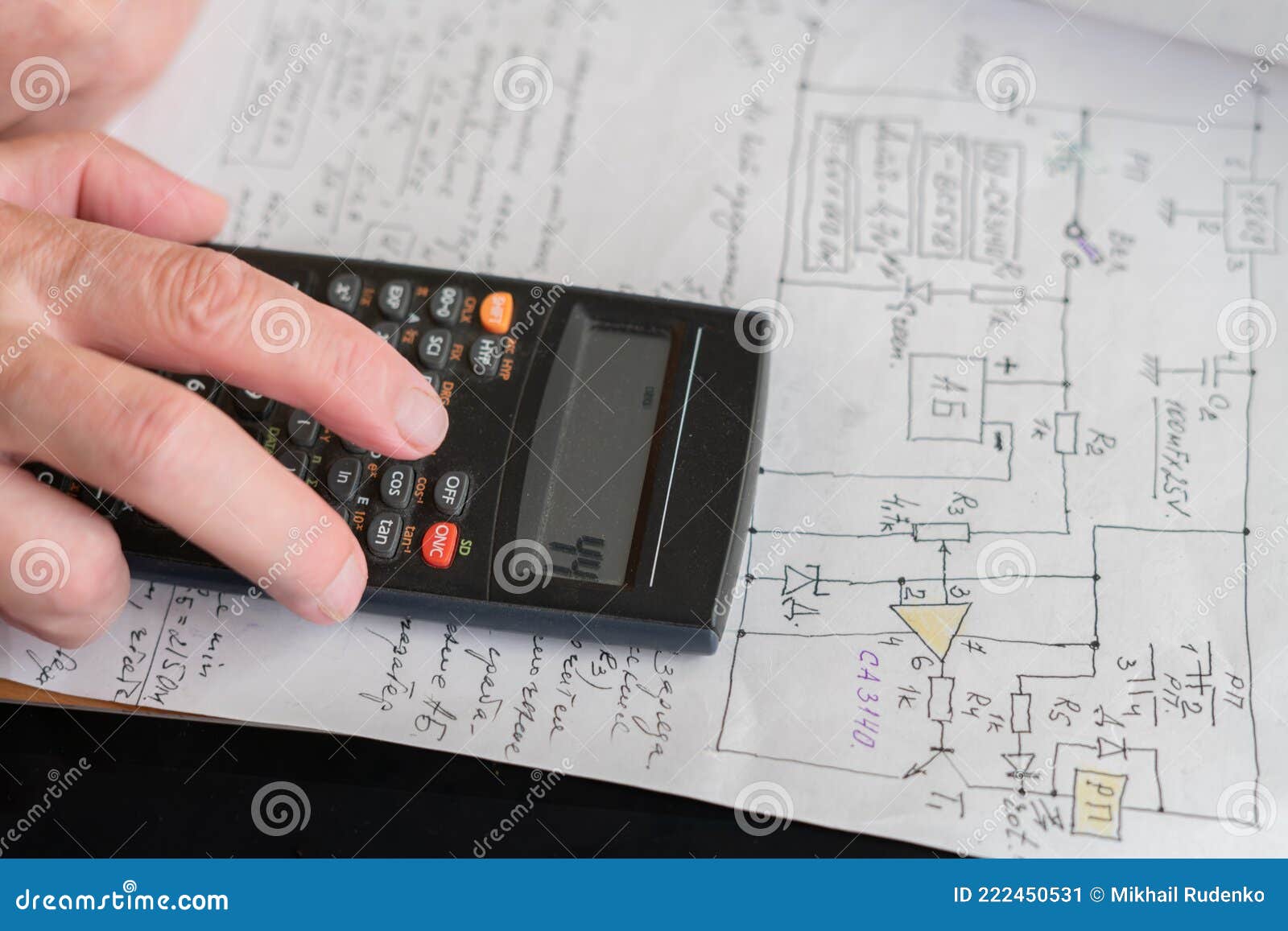 Old Man Doing Some Math Calculations Using Digital Calculator at His ...