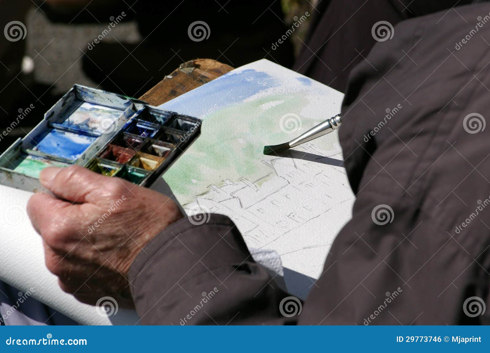 Man painting a watercolour stock photo. Image of hand - 29773746