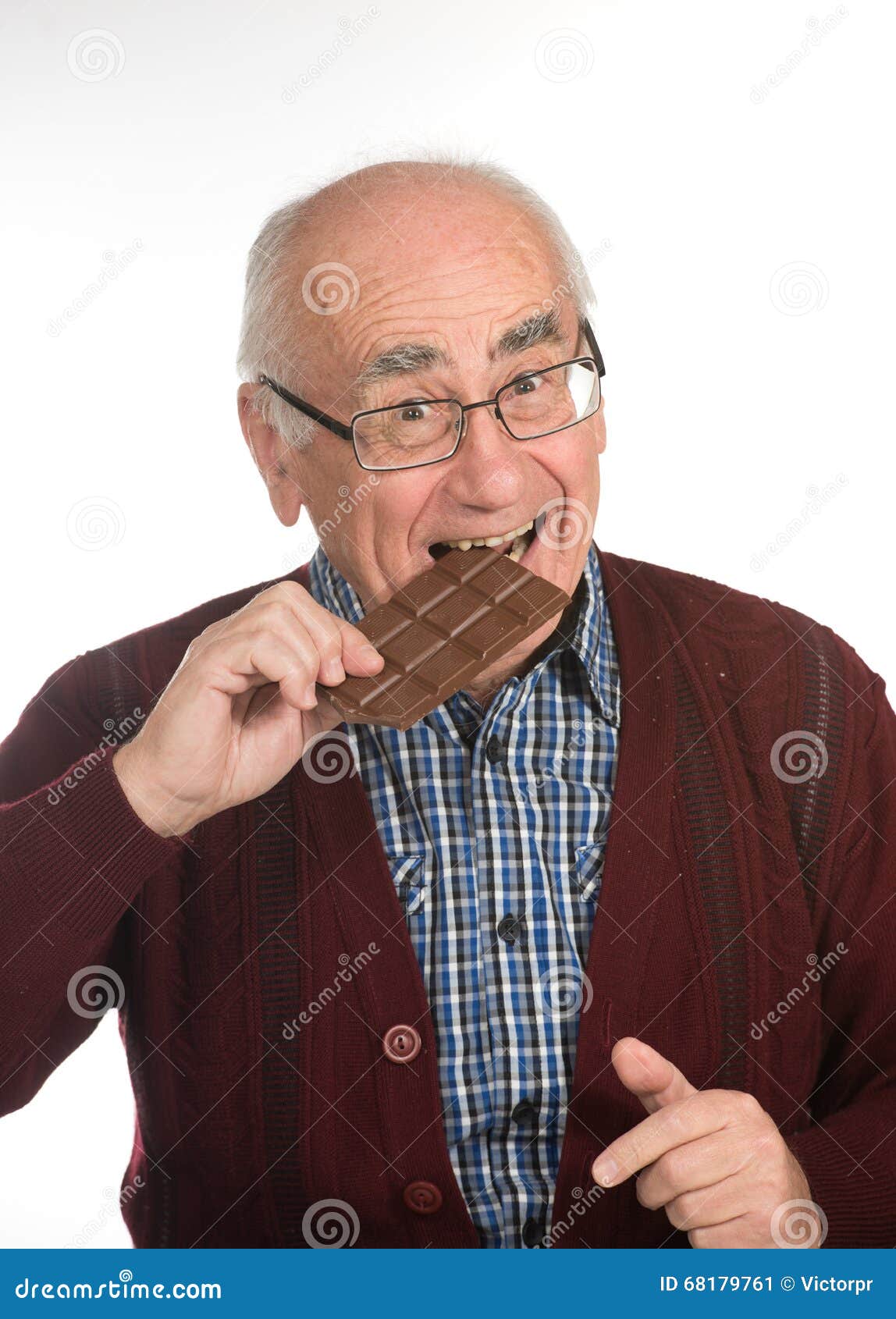 Old man eating chocolate stock image. Image of glasses - 68179761