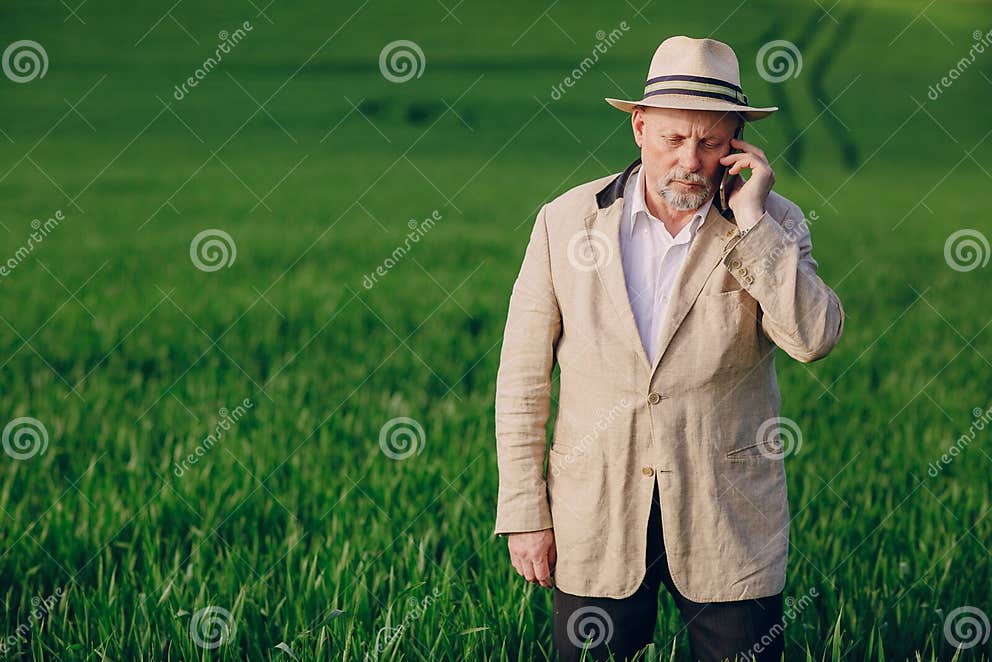 Old man in field stock photo. Image of background, green - 90130710