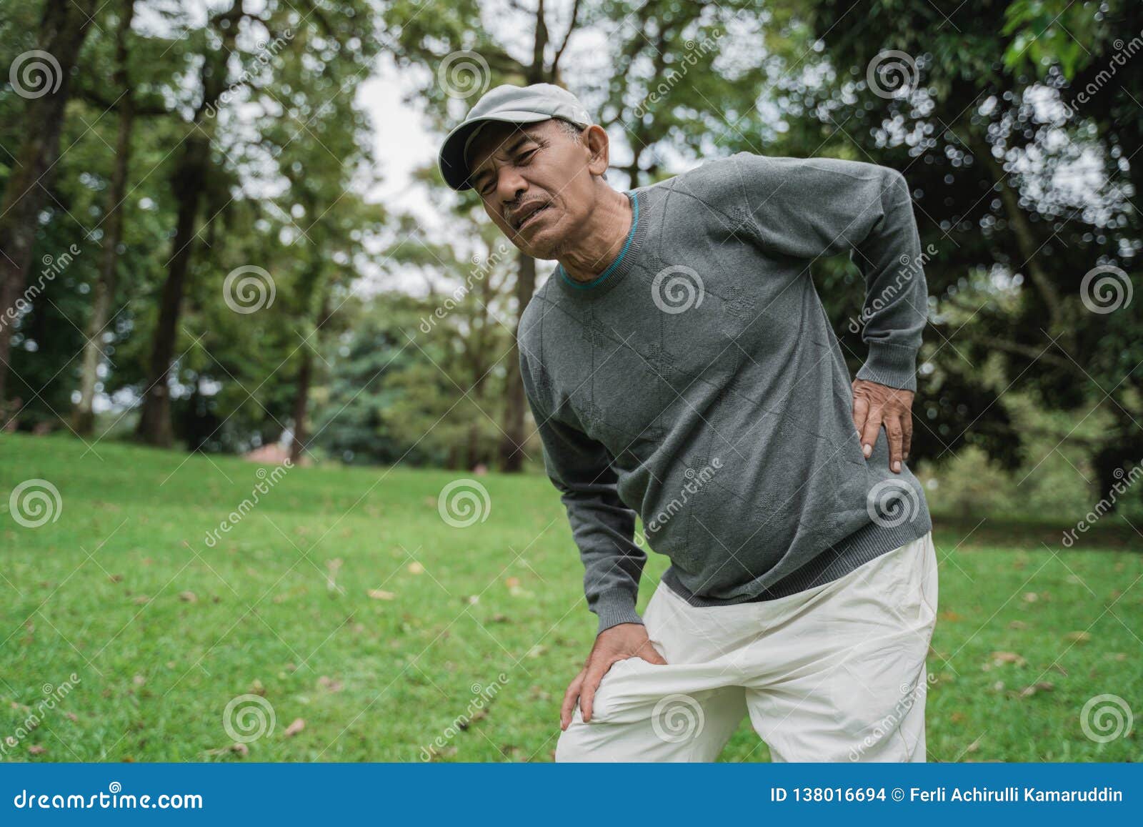 Old Man Having Back Pain while in the Park Stock Photo - Image of ...