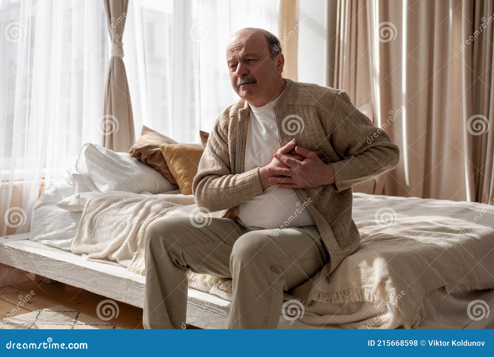Old Man with Heart Attack Sitting Alone at Home. Stock Photo - Image of ...