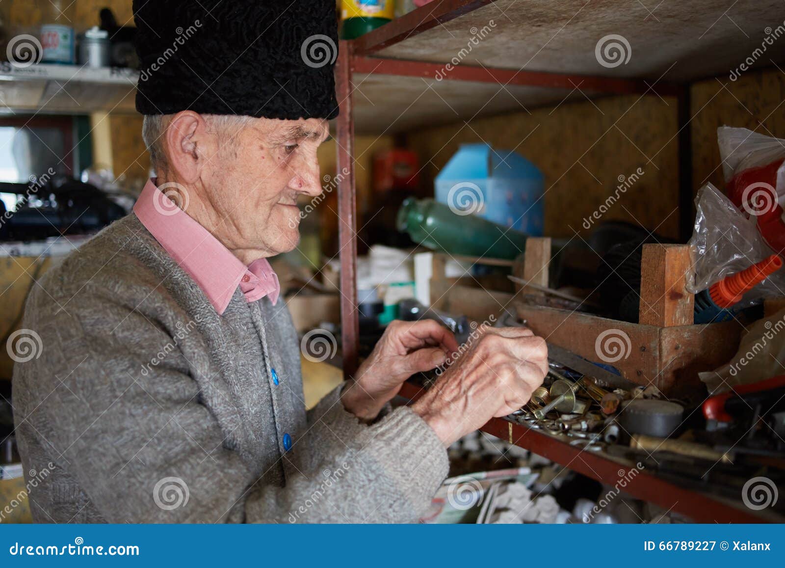 Old man in his tool shed stock image. Image of engineering - 66789227