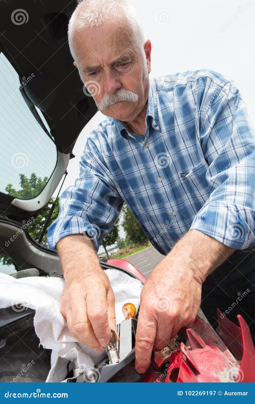 Old Man Installs Tail Light on Vehicle Stock Image - Image of technique ...