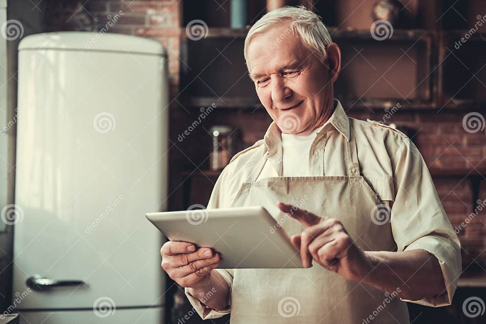 Old man in kitchen stock photo. Image of adult, knife - 97136368