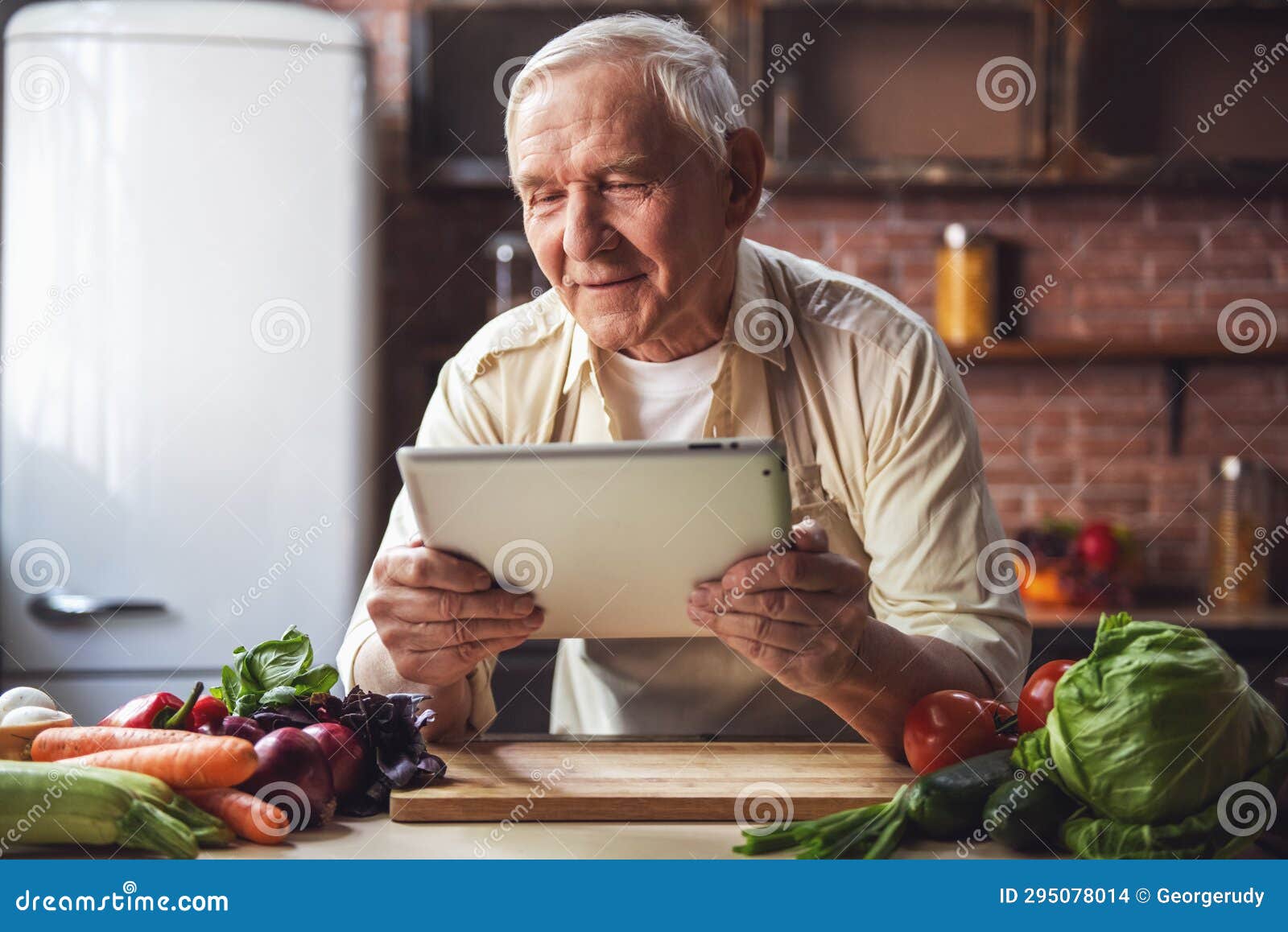 Old man in the kitchen stock photo. Image of preparation - 295078014