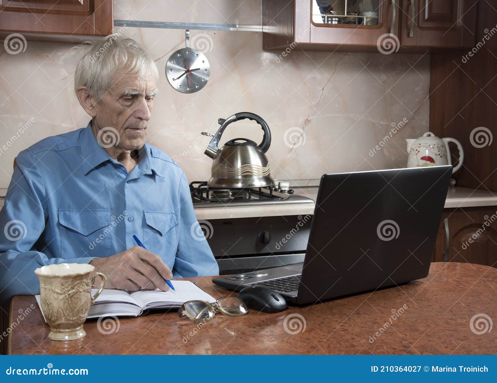 Old Man Learning Computer at Kitchen. Senior Man Studying Laptop. E ...