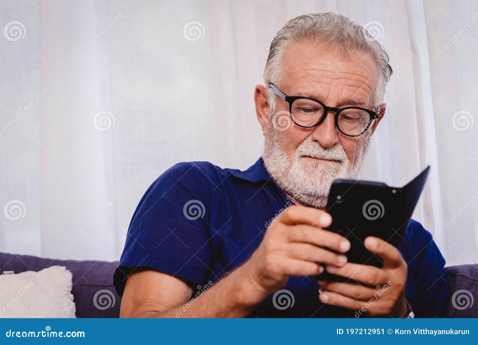 Old Man Looking at the Smartphone for Reading News Update or Playing ...