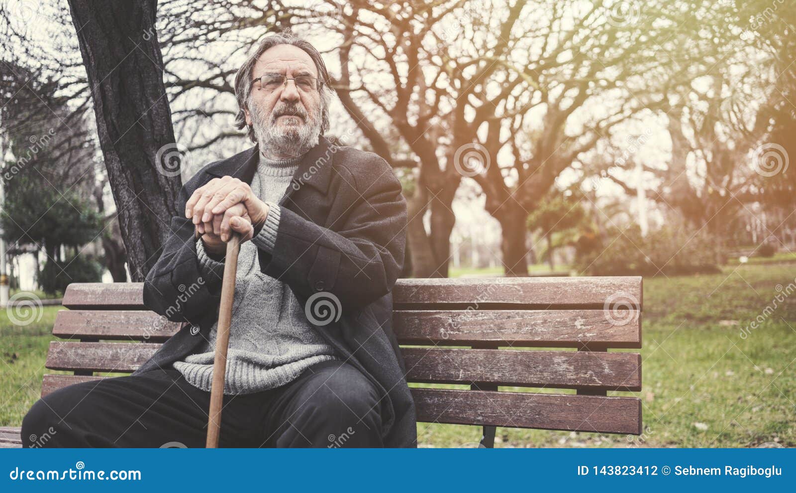 Old man in the park stock photo. Image of sitting, cane - 143823412