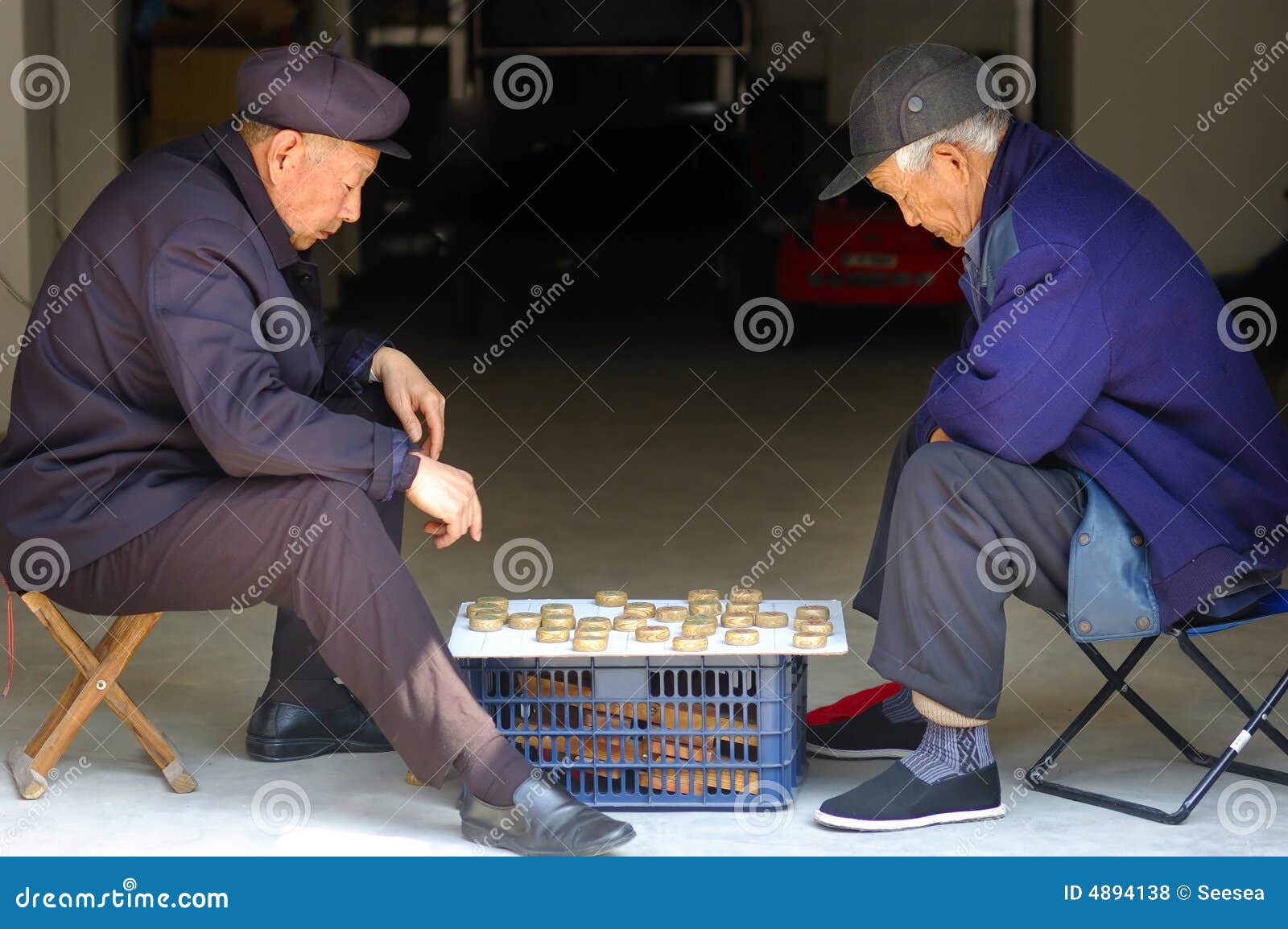Old man play Chinese Chess stock photo. Image of health - 4894138