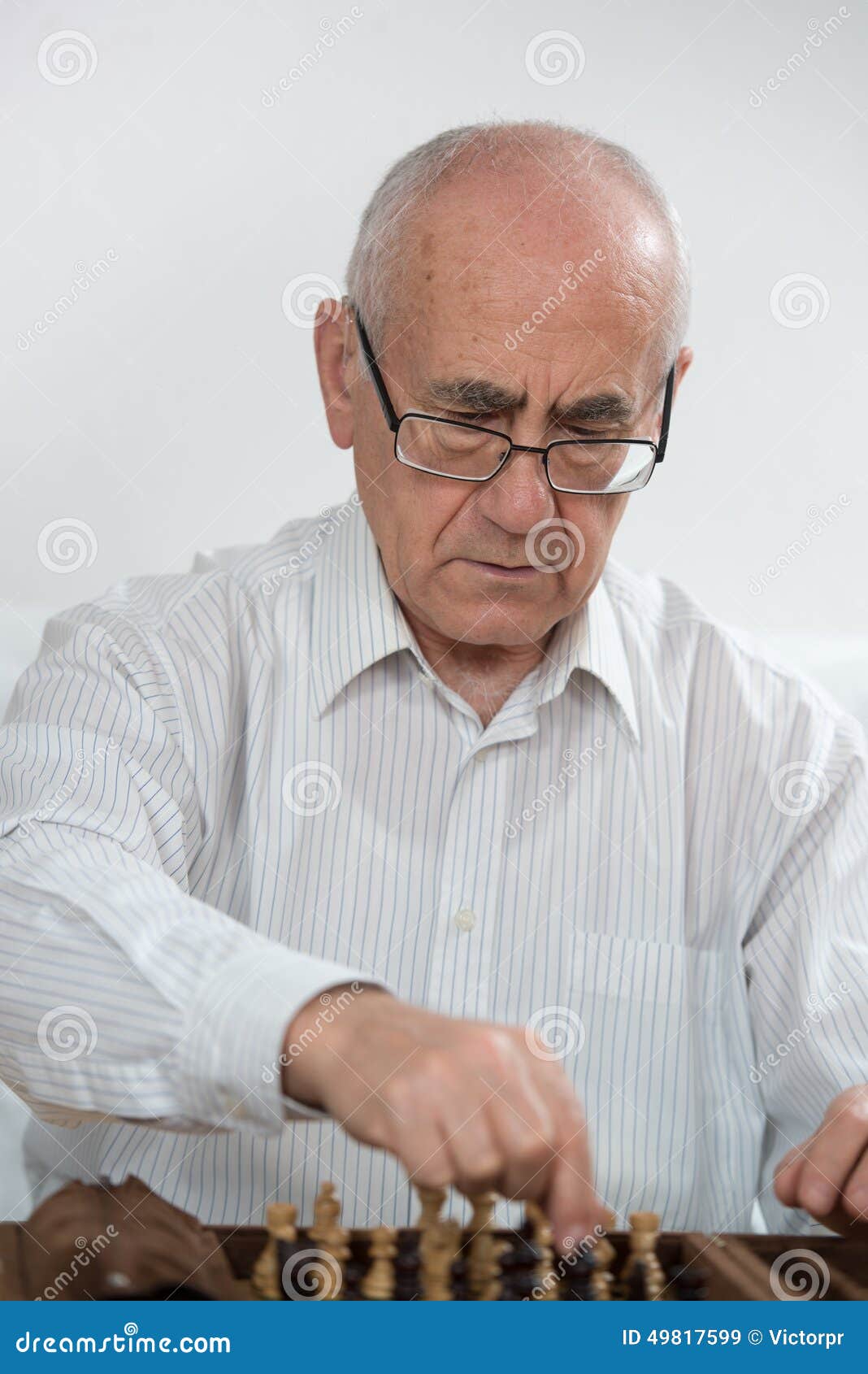 Old man playing chess stock image. Image of figure, playing - 49817599
