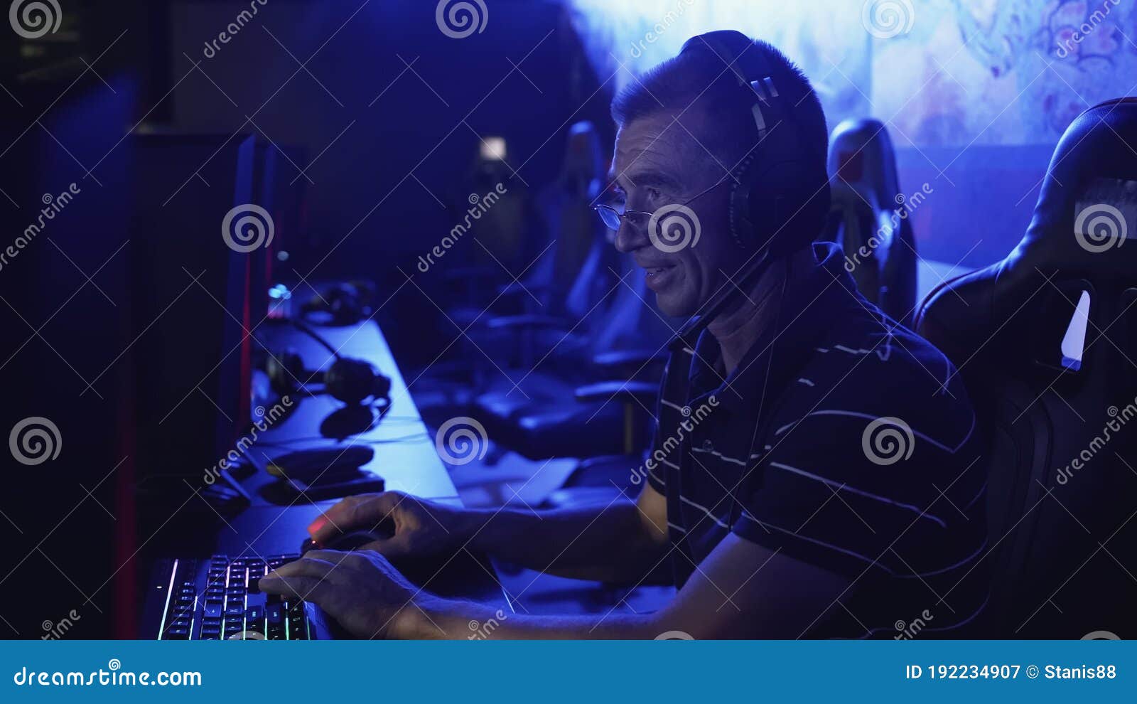 Old Man Playing on Computer Late at Night in Modern Computer Club ...
