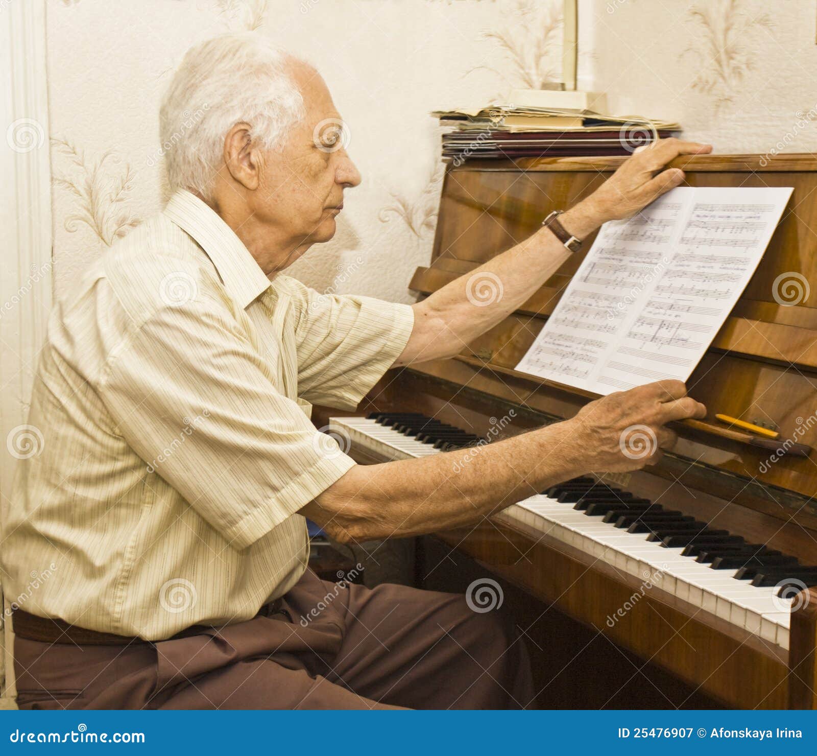 Old man playing piano stock image. Image of elderly, piano - 25476907