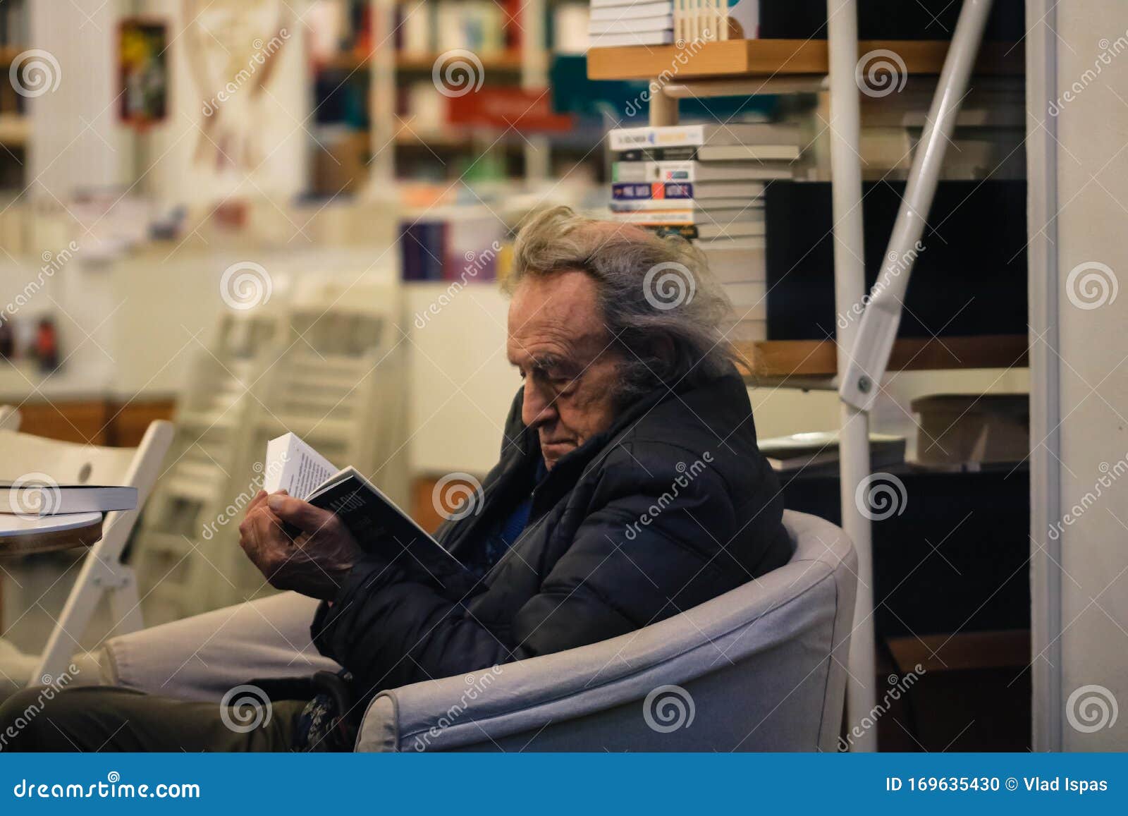 Old Man Reading a Book in a Library in Bucharest, Romania, 2020 ...