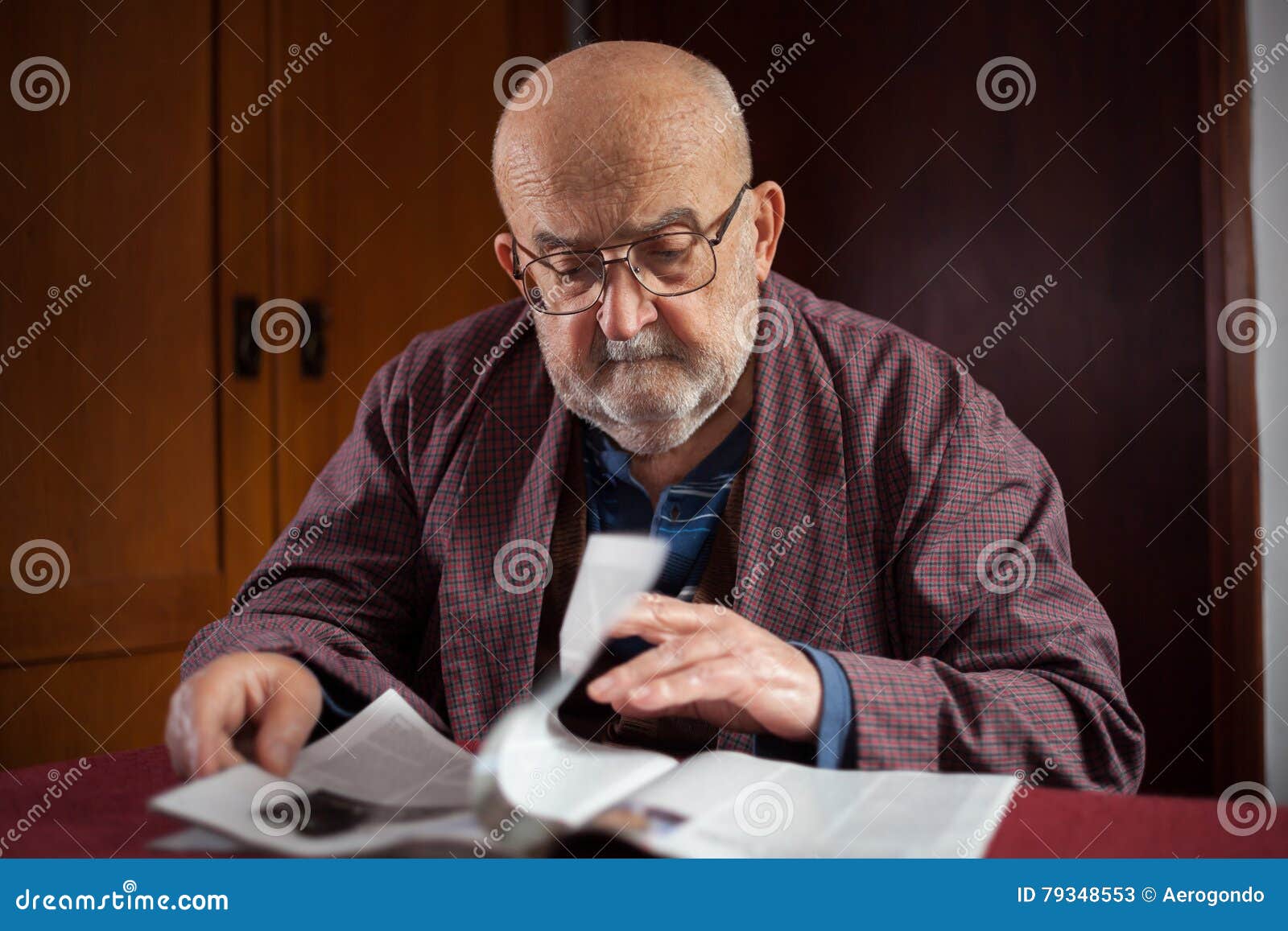 Old man reading magazine stock image. Image of mature - 79348553
