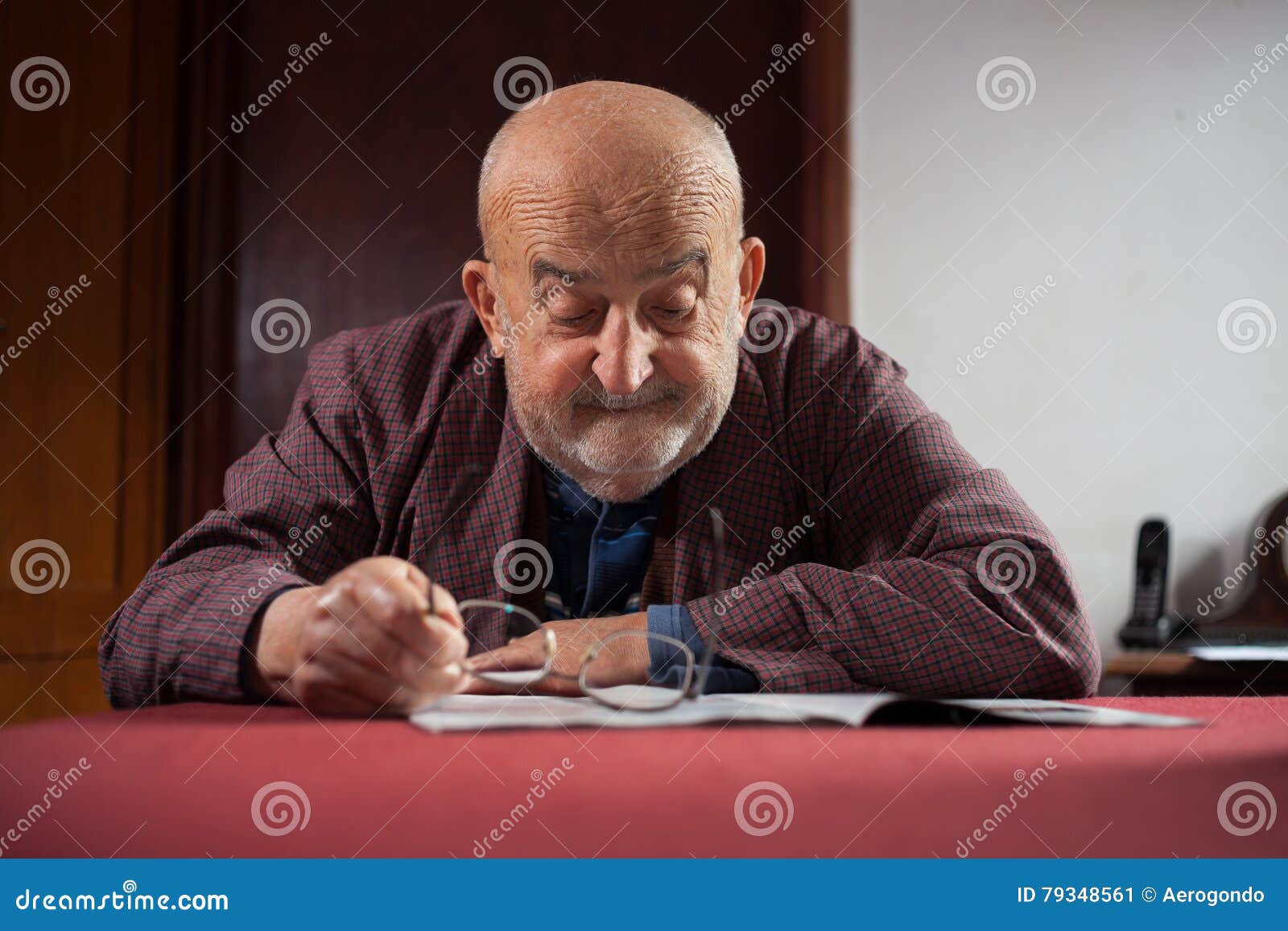 Old man reading magazine stock image. Image of journal - 79348561