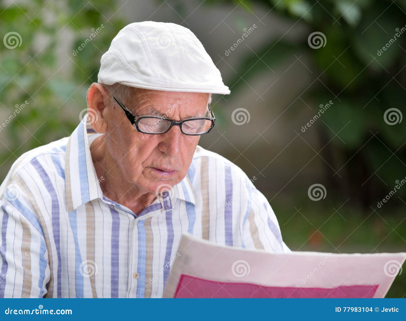 Old man reading newspaper stock photo. Image of news - 77983104