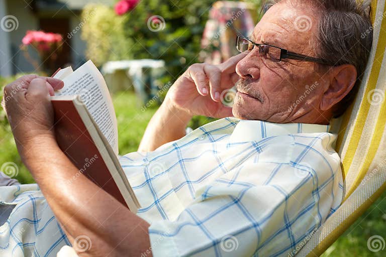 Old man reading outdoor stock image. Image of american - 8503263