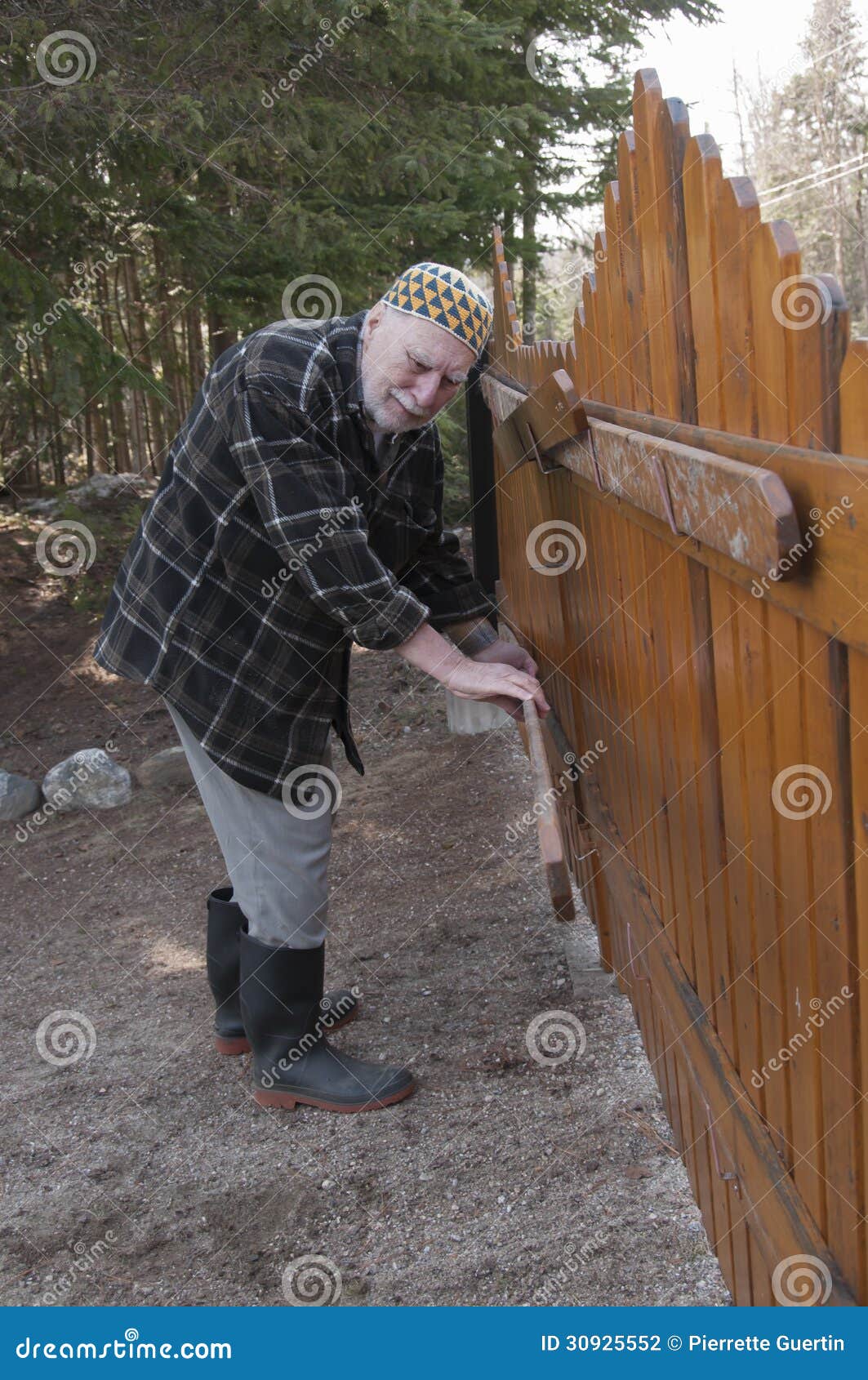 Old man repairing a gate stock photo. Image of home, nature - 30925552