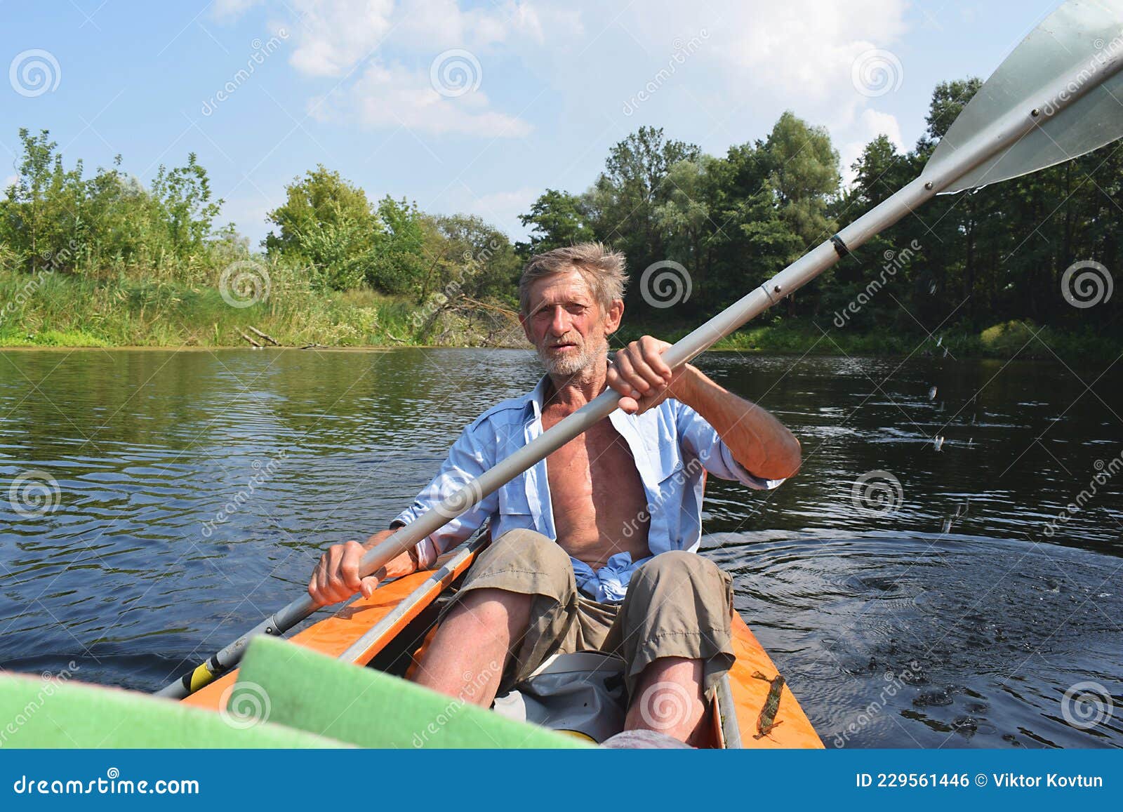 The Old Man Rowing a Kayak on the River Stock Photo - Image of ...