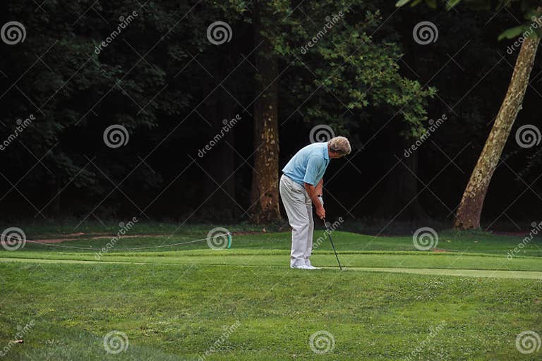 Old Man Senior Practicing Golf in the Green Grass Field - Activity ...