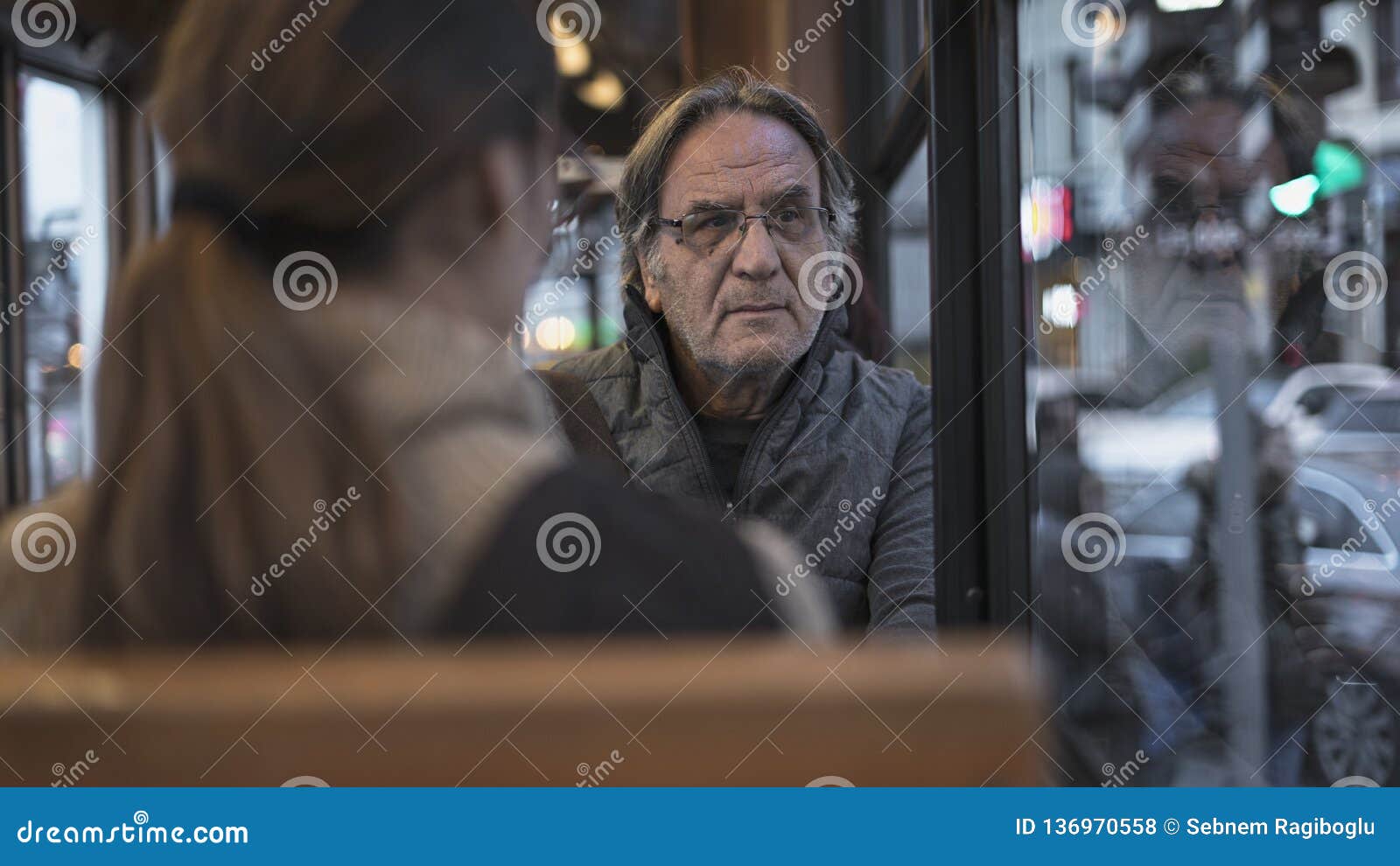 Old man sitting on the bus stock photo. Image of elderly - 136970558