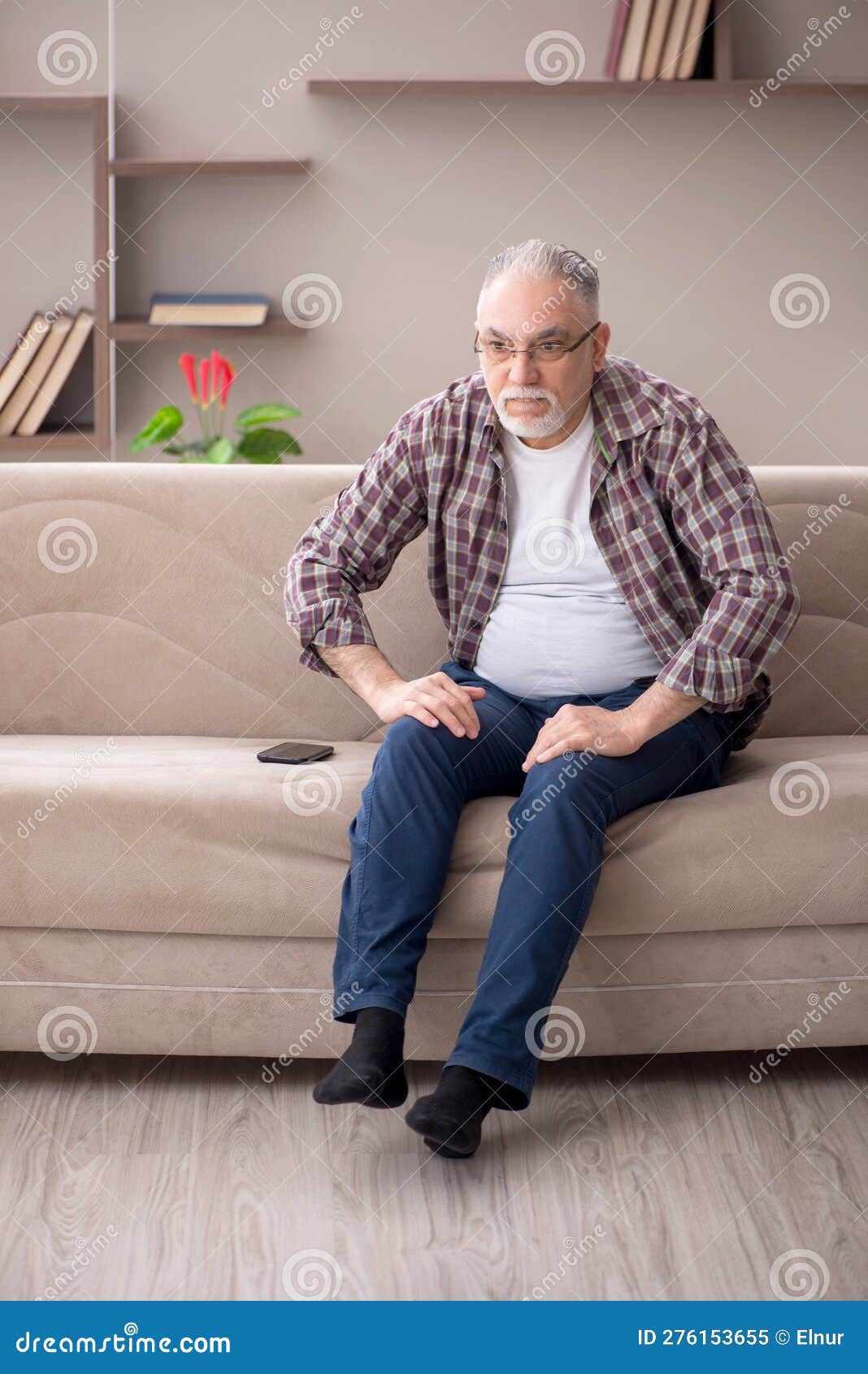 Old man sitting at home stock image. Image of covid - 276153655