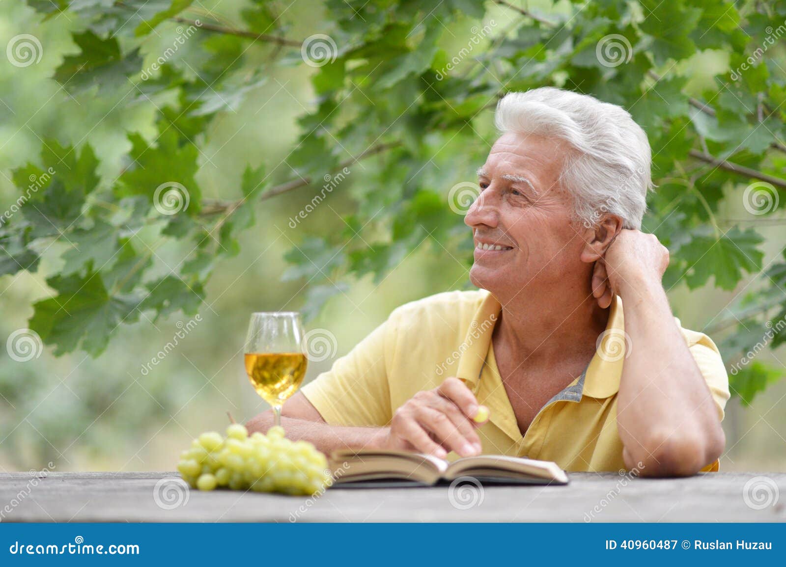 Old man sitting at a table stock image. Image of food - 40960487