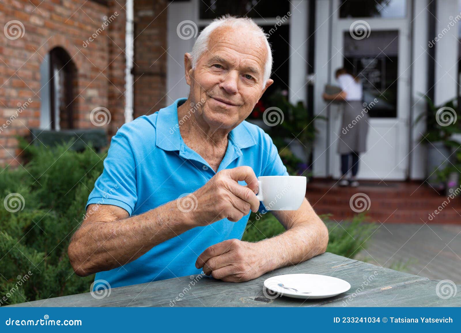 Old Man Sitting at Table in Outdoor Cafe and Drinking Tea Stock Photo ...