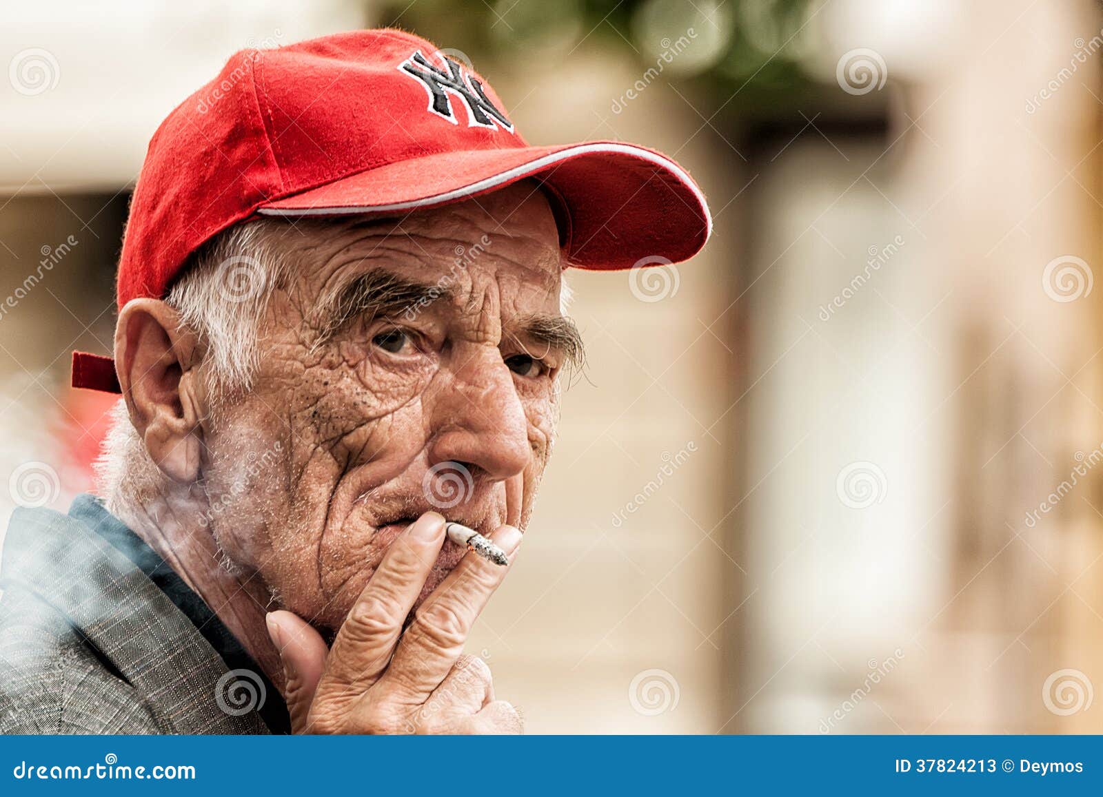 Old Man Smoking A Cigarette On The Bench In Zagreb Center Square ...