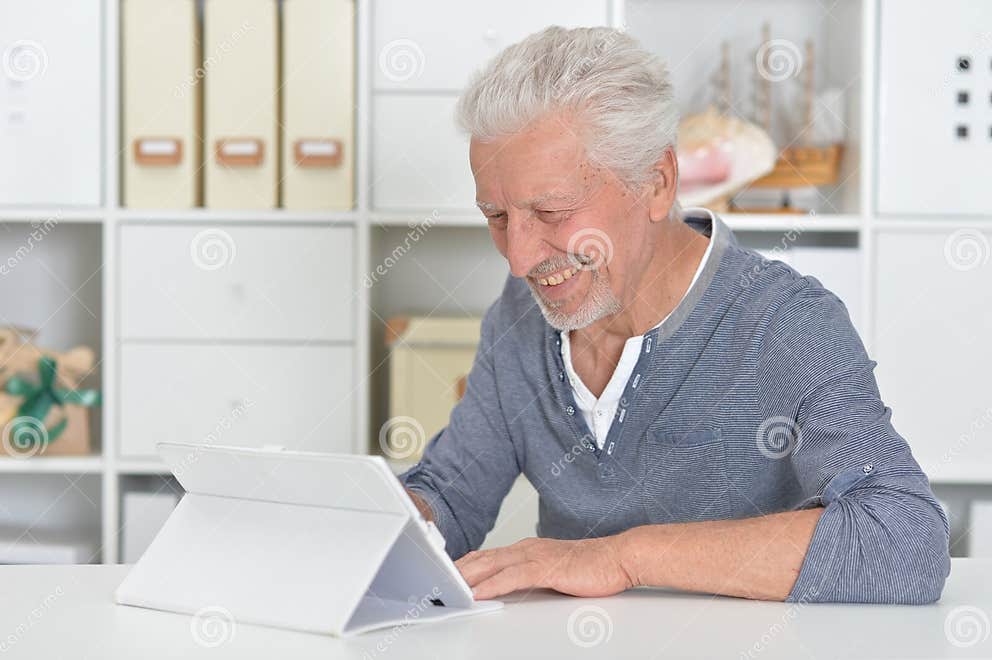Old Man with Tablet Computer at Home Stock Photo - Image of tech ...