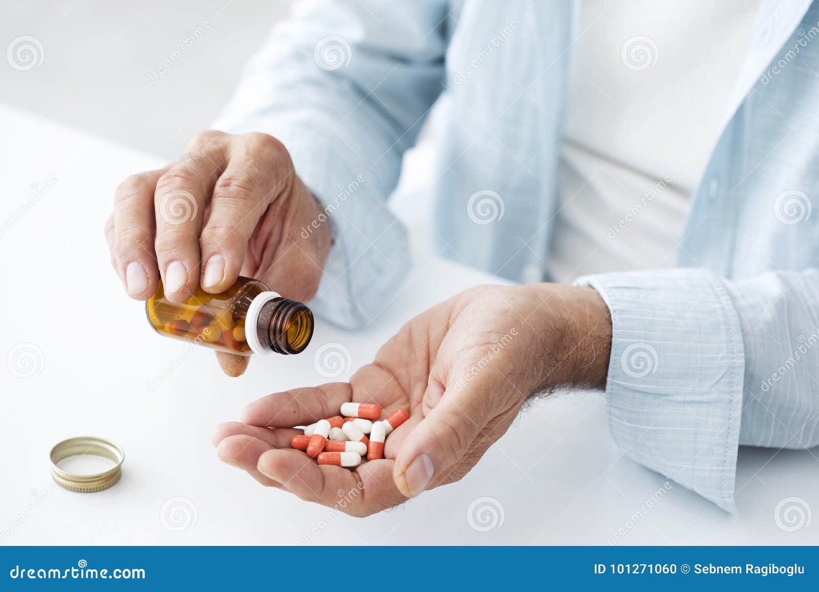 Old man taking pills stock photo. Image of elderly, holding - 101271060