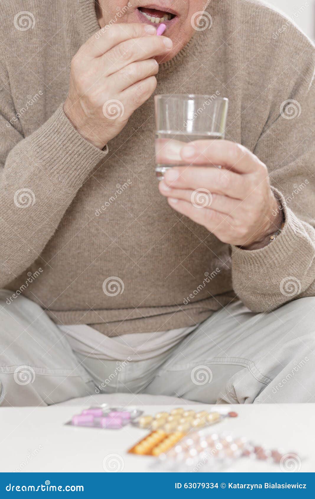 Old man taking tablet stock photo. Image of medication - 63079334