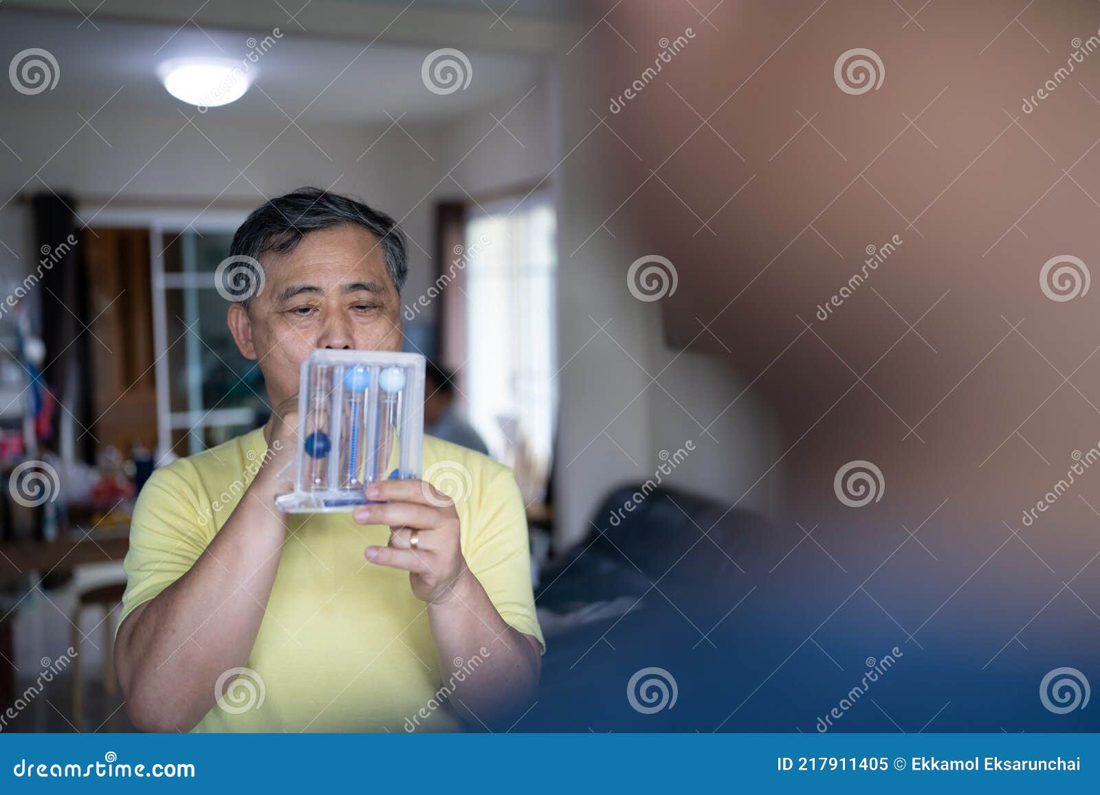 Old Man Uses a Tri-ball Incentive Spirometer for Check His Lung ...