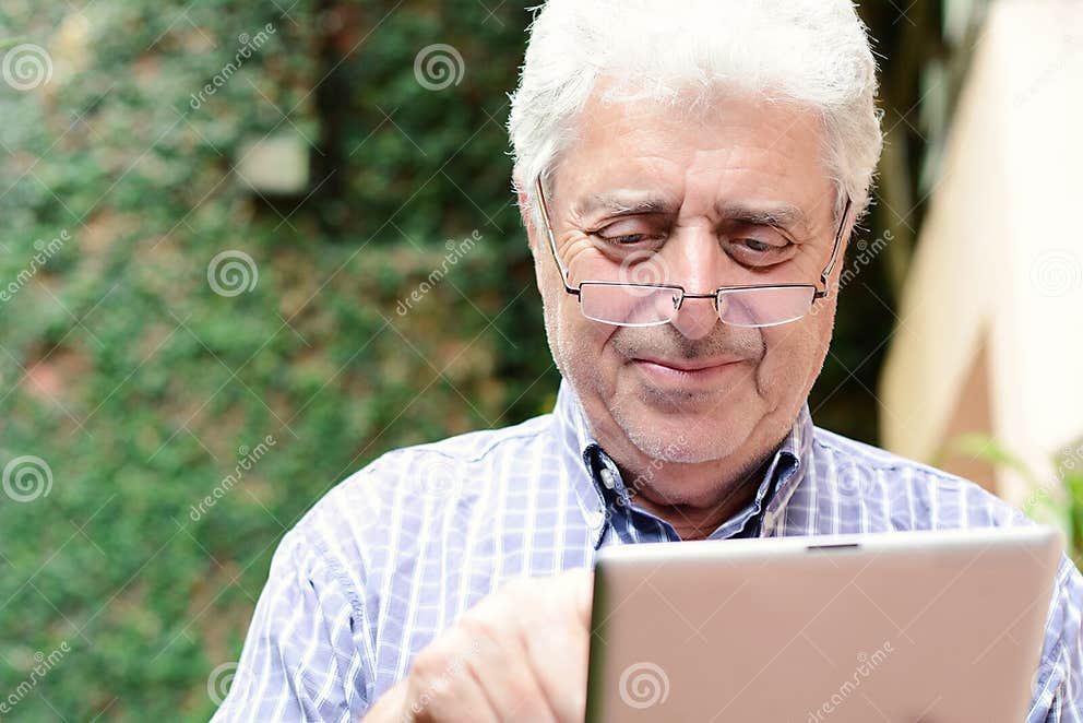 Old Man Using Digital Tablet. Stock Image - Image of portable, looking ...