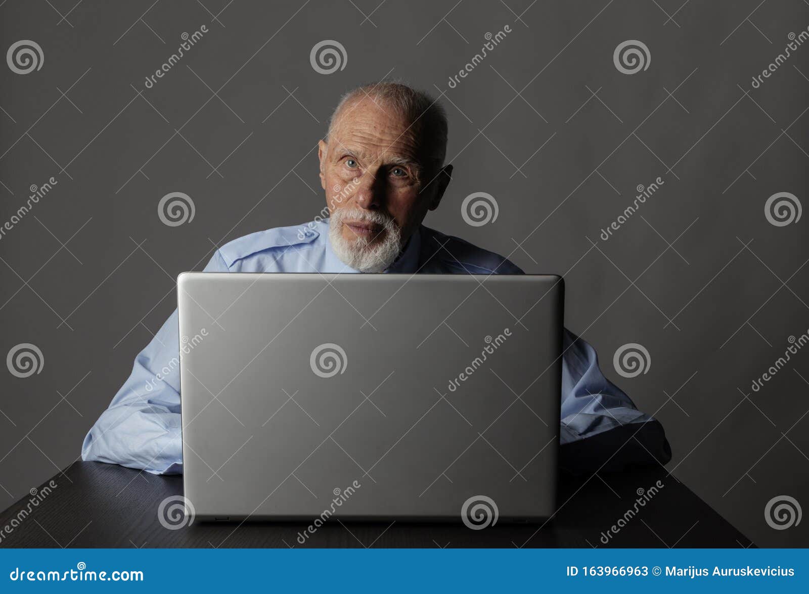 Old man using a laptop stock image. Image of browsing - 163966963