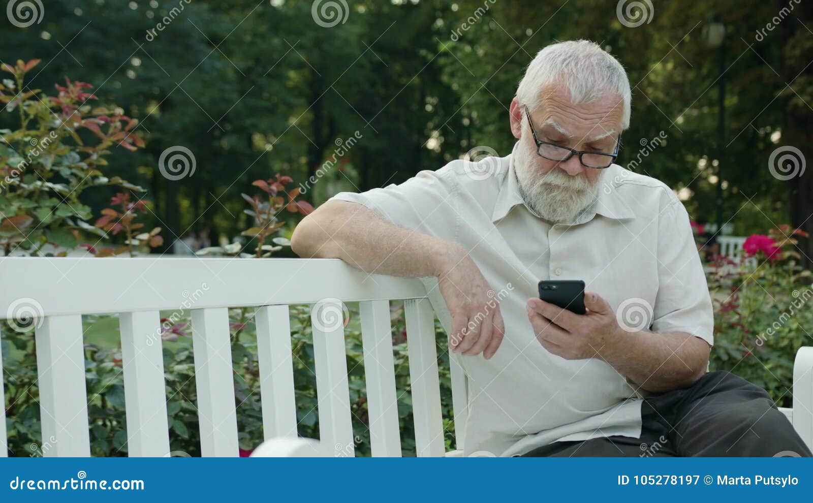 Old Man Using a Phone Outdoors Stock Image - Image of bench, outside ...