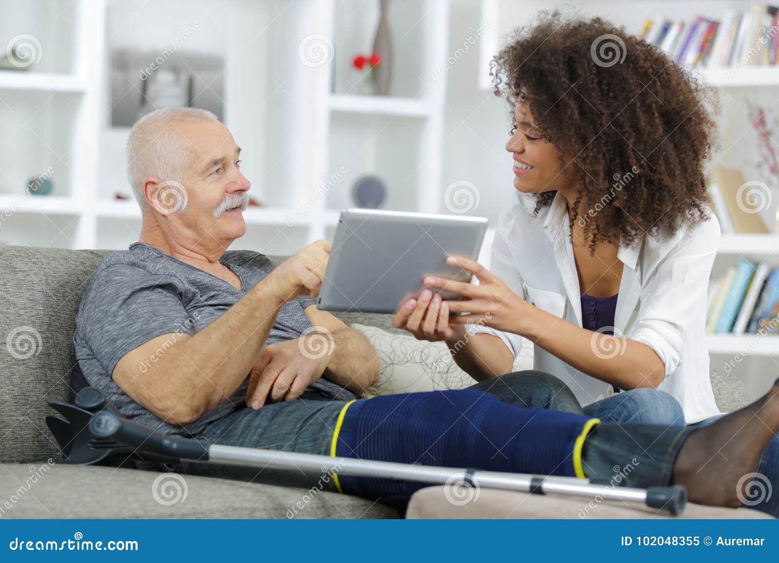 Old Man Using Tablet with Help Assitant Stock Image - Image of internet ...