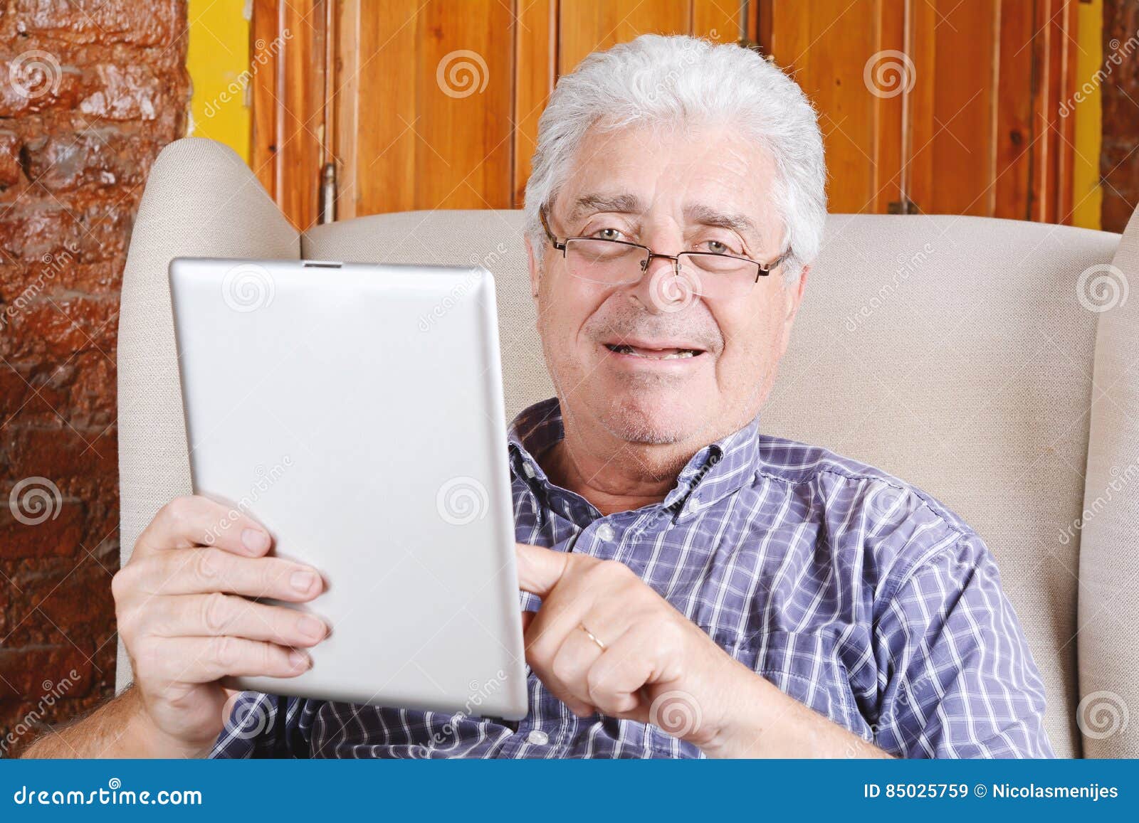 Old man using tablet. stock image. Image of elderly, adult - 85025759