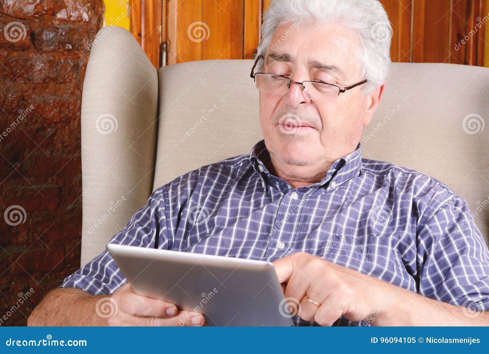 Old man using tablet. stock image. Image of computer - 96094105