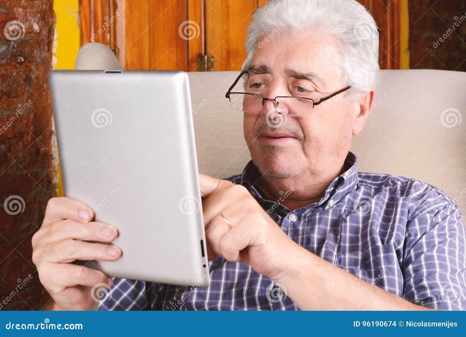 Old man using tablet. stock photo. Image of holding, digital - 96190674