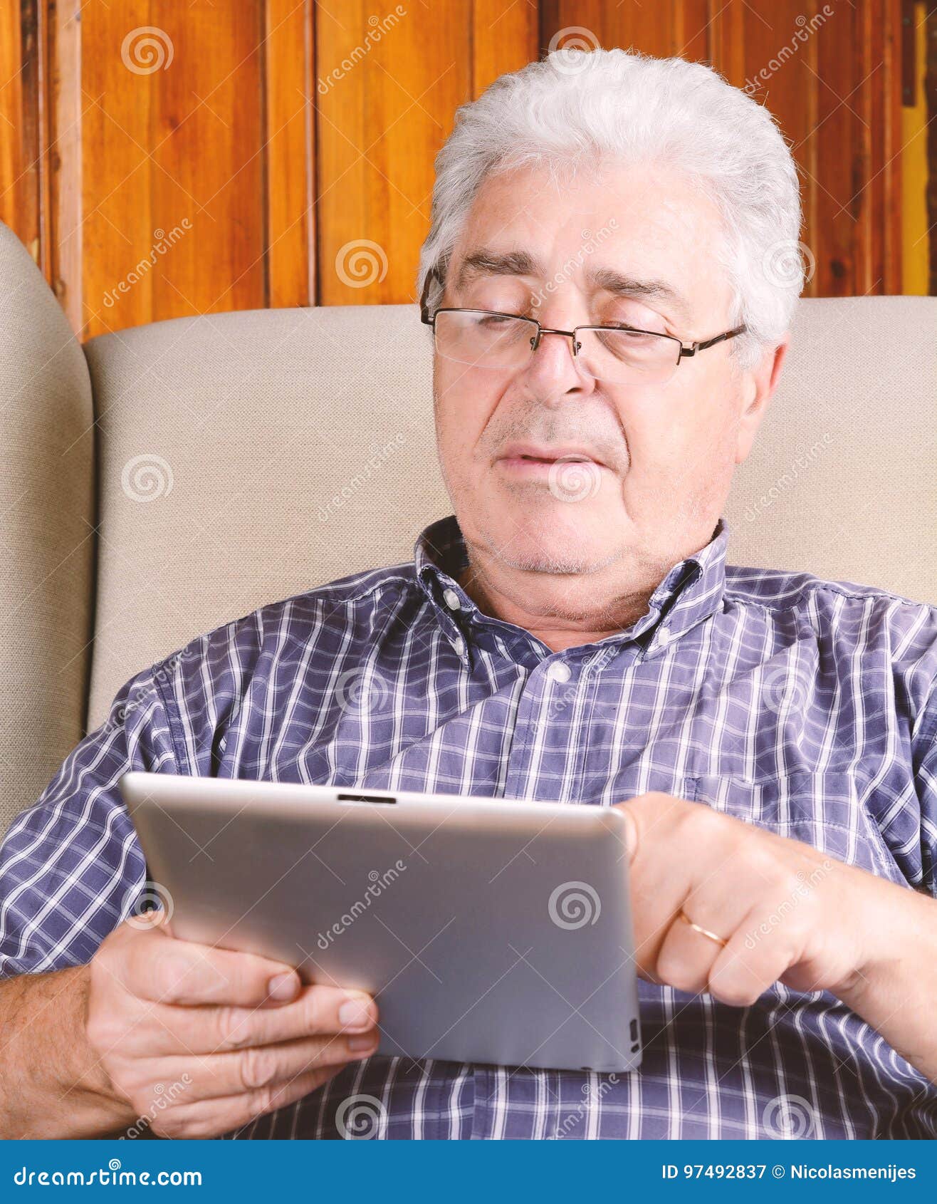 Old man using tablet. stock image. Image of home, holding - 97492837