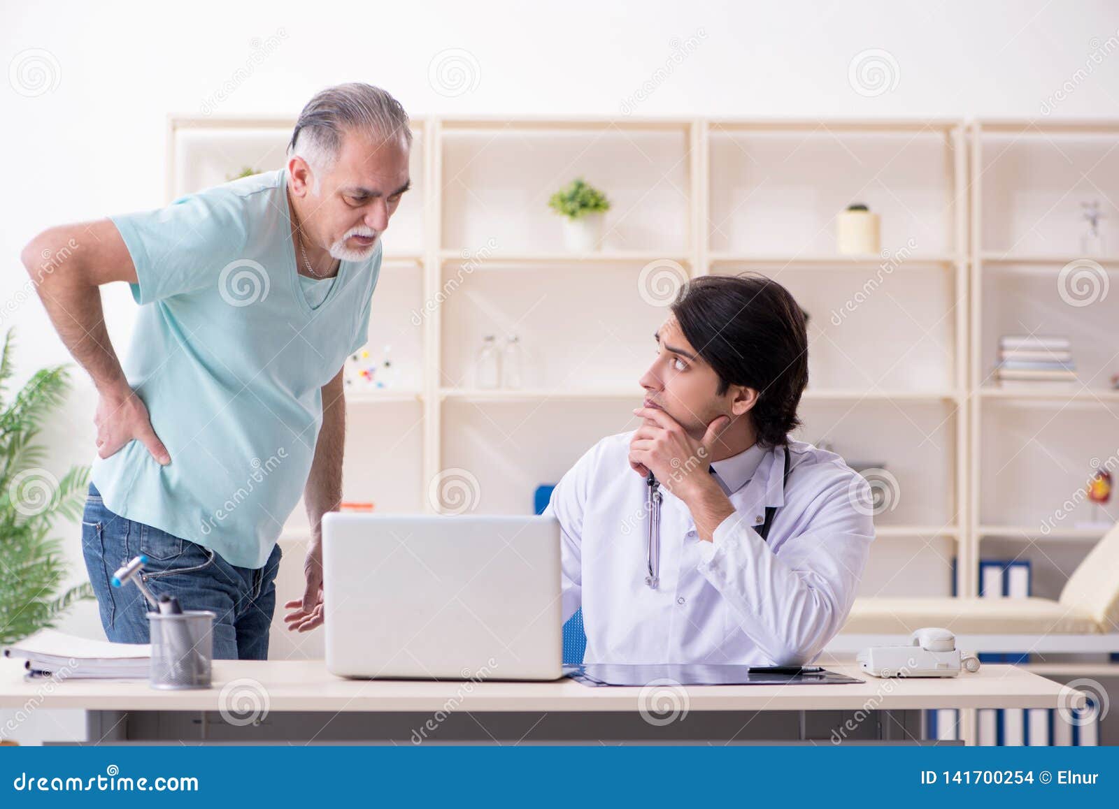 The Old Man Visiting Young Male Doctor Stock Photo - Image of ...
