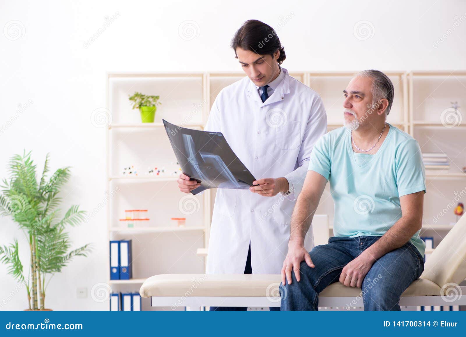 The Old Man Visiting Young Male Doctor Stock Photo - Image of checkup ...