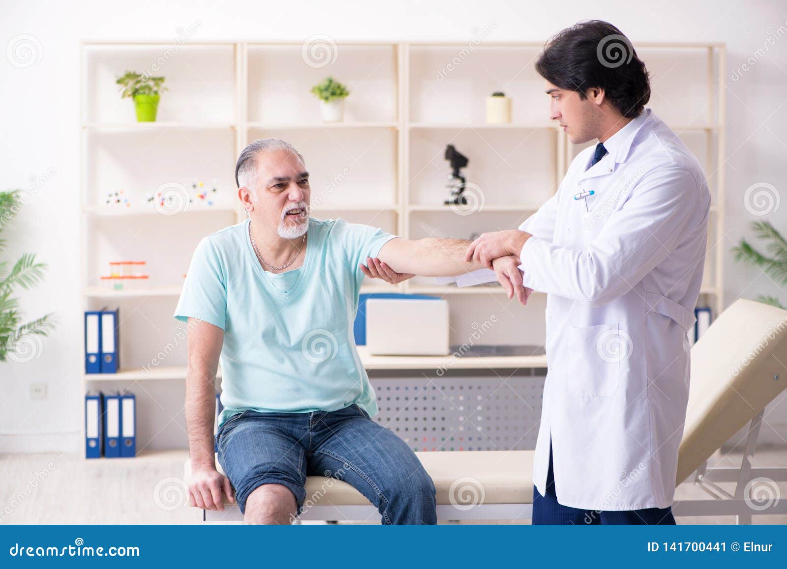 The Old Man Visiting Young Male Doctor Stock Image - Image of exam ...