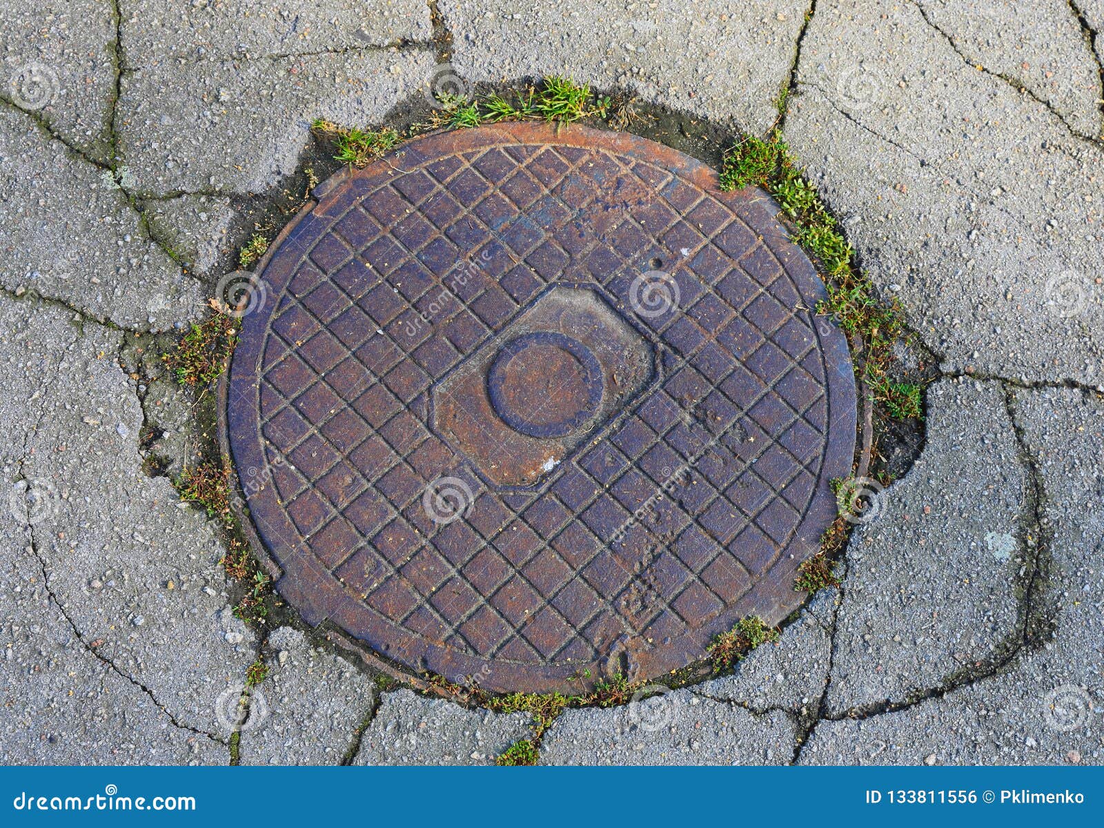 Old manhole on asphalt stock photo. Image of construction - 133811556