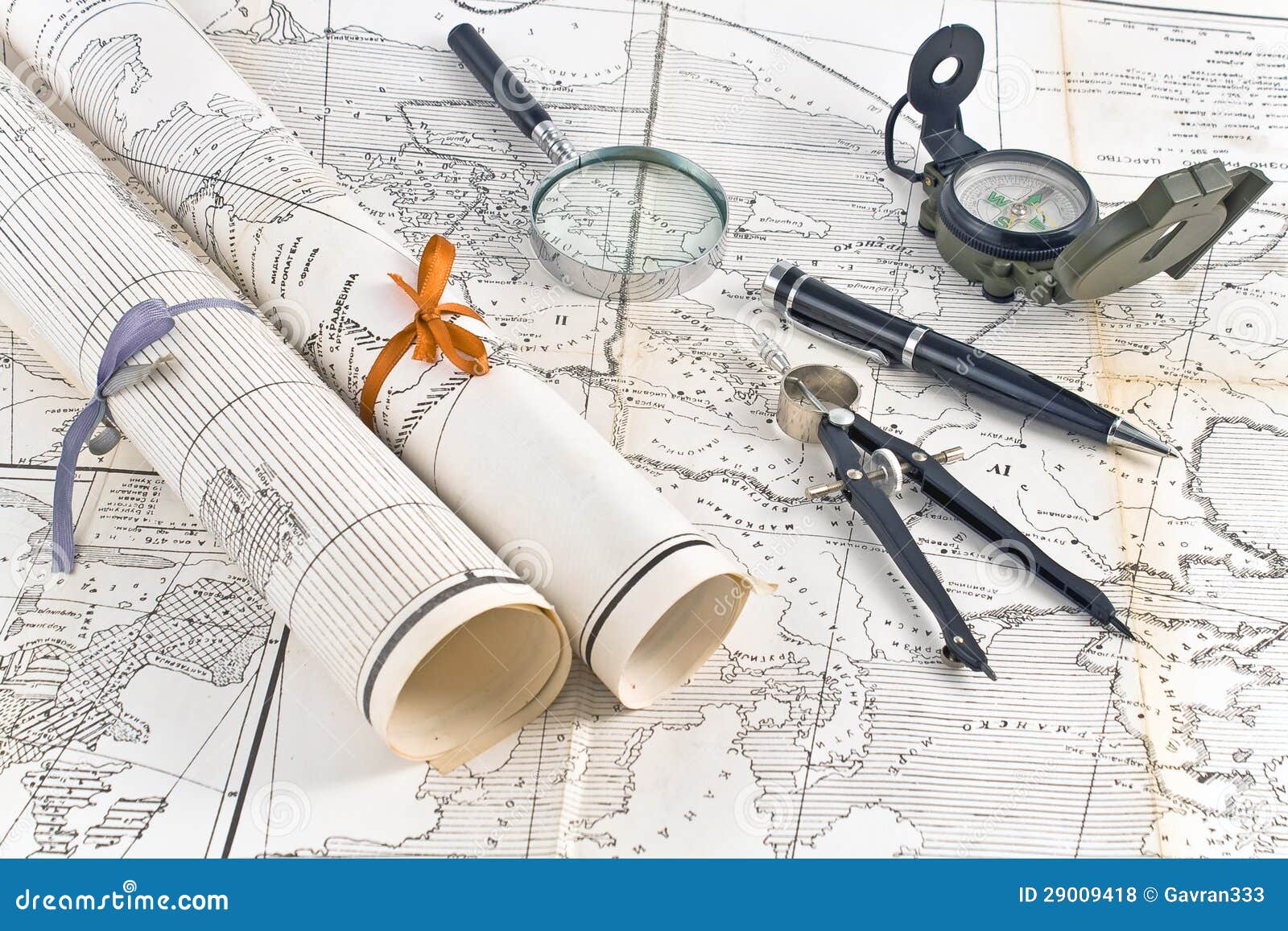 Old Maps in Rolls with Magnifier and Compass Stock Photo - Image of ...