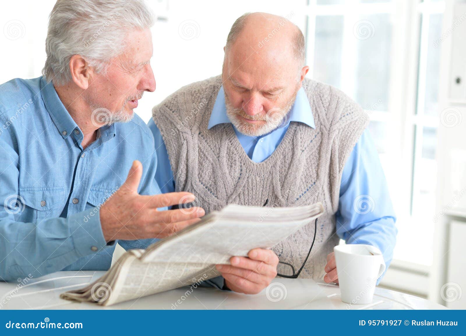 Old Men Reading a Newspaper Stock Image - Image of white, adult: 95791927